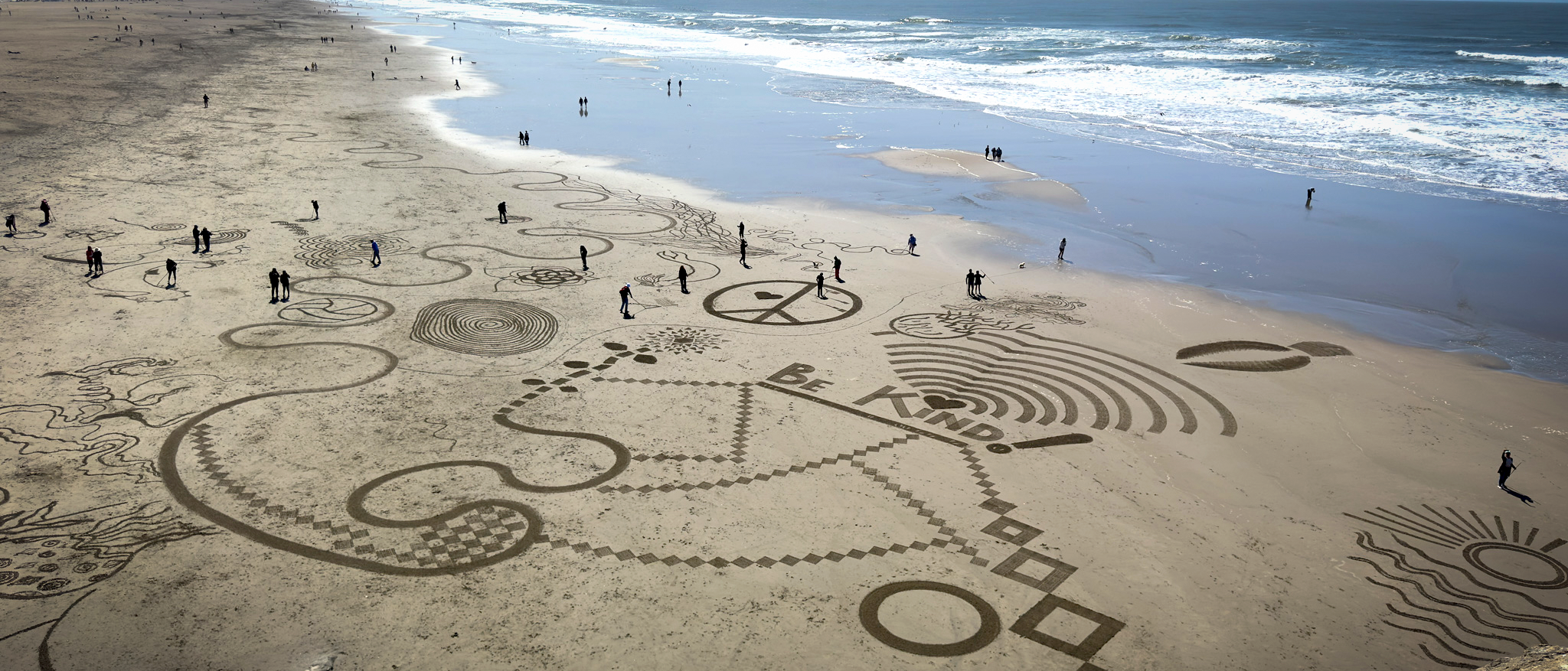 Designs In Sand At Beach With Rake