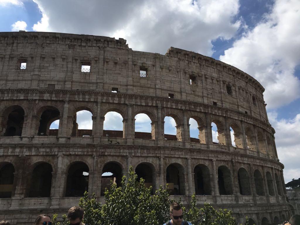 A woman praying in Rome. Sun and shadow play across the white… | by ...