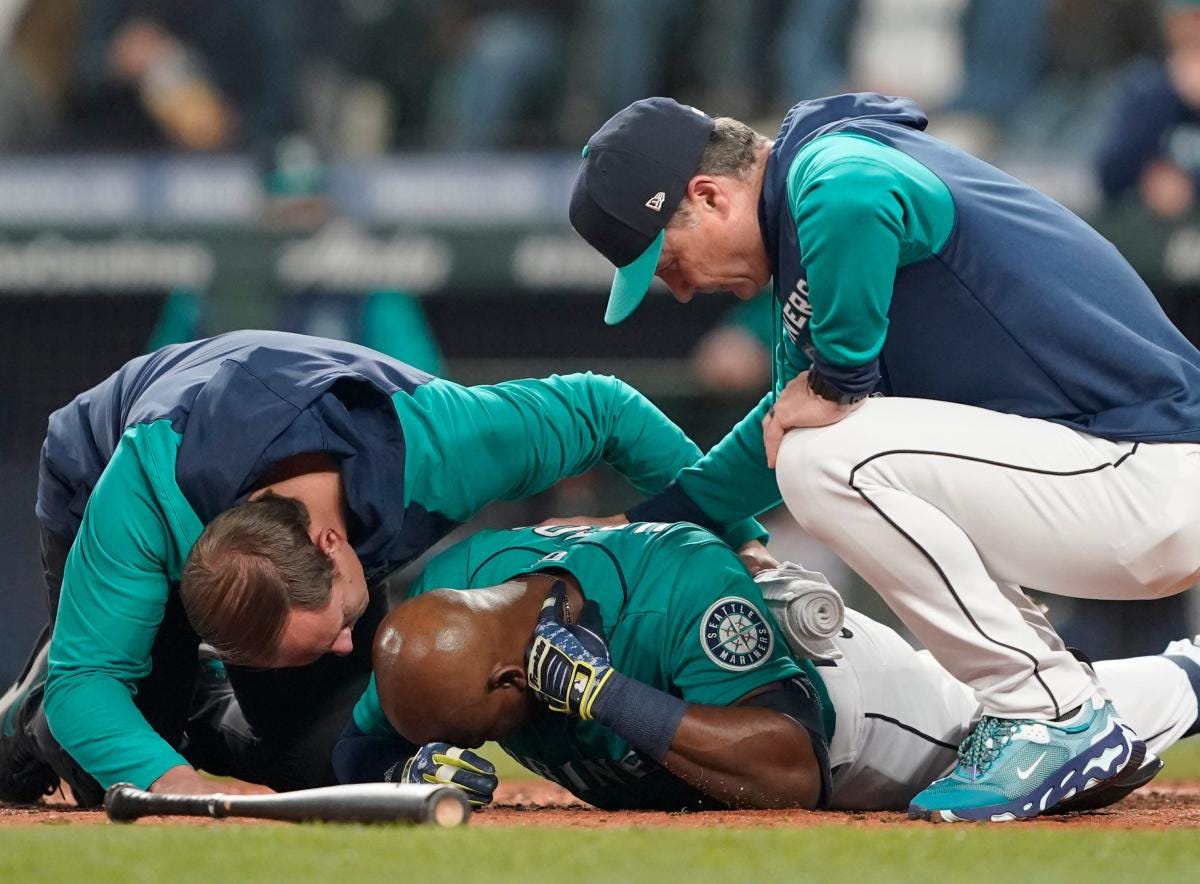Mariners’ Justin Upton hit in helmet by pitch; Pitcher Michael Lorenzen ...