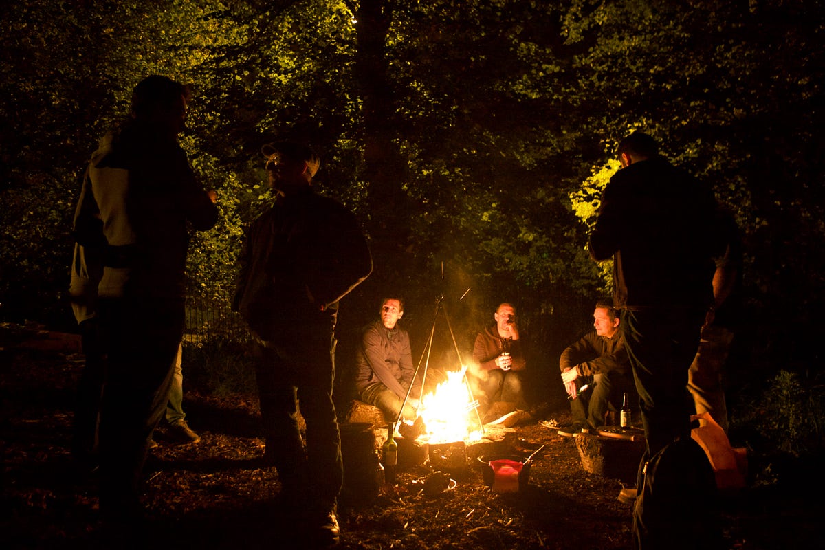 Lighting a fire in the darkness. Sparks exploded into the darkness as I ...