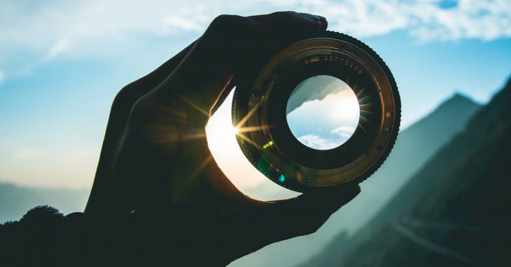 Looking through a lens. The world can be seen from many… | by Sam ...
