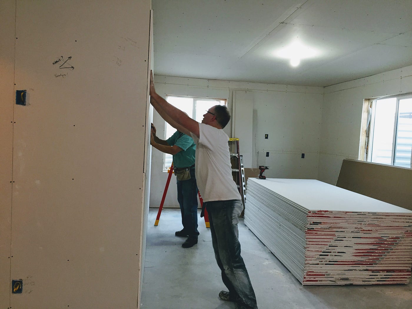 Drywalling the studio’s outer wall — using double 5/8" drywall and ...