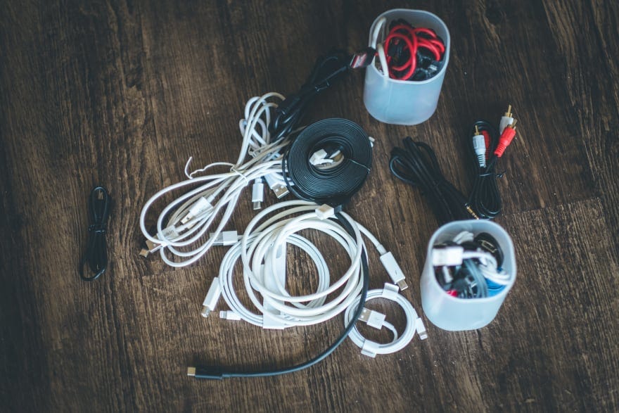 A tip to declutter unused cables with a tape writer and pouches ...