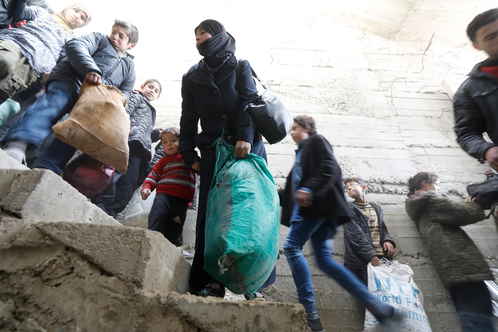 Tens of thousands evacuating from cities, tens of thousands more remain ...
