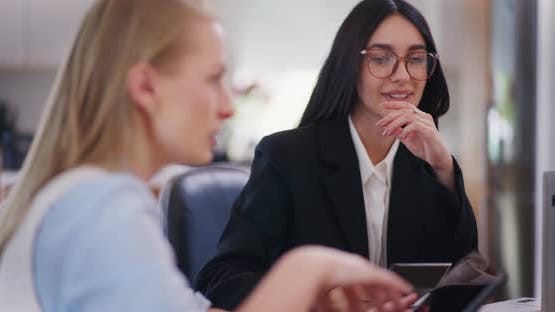 Two Women Negotiate During Business Meeting - Photonpathfinder - Medium