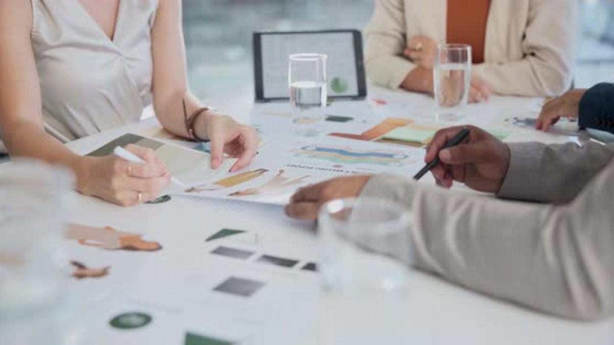 Fashion designer, documents and planning in meeting with creative ...