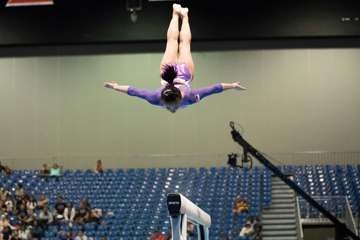 The Evolution of Gymnastics Scoring: The Perfect 10 Is Gone, but ...