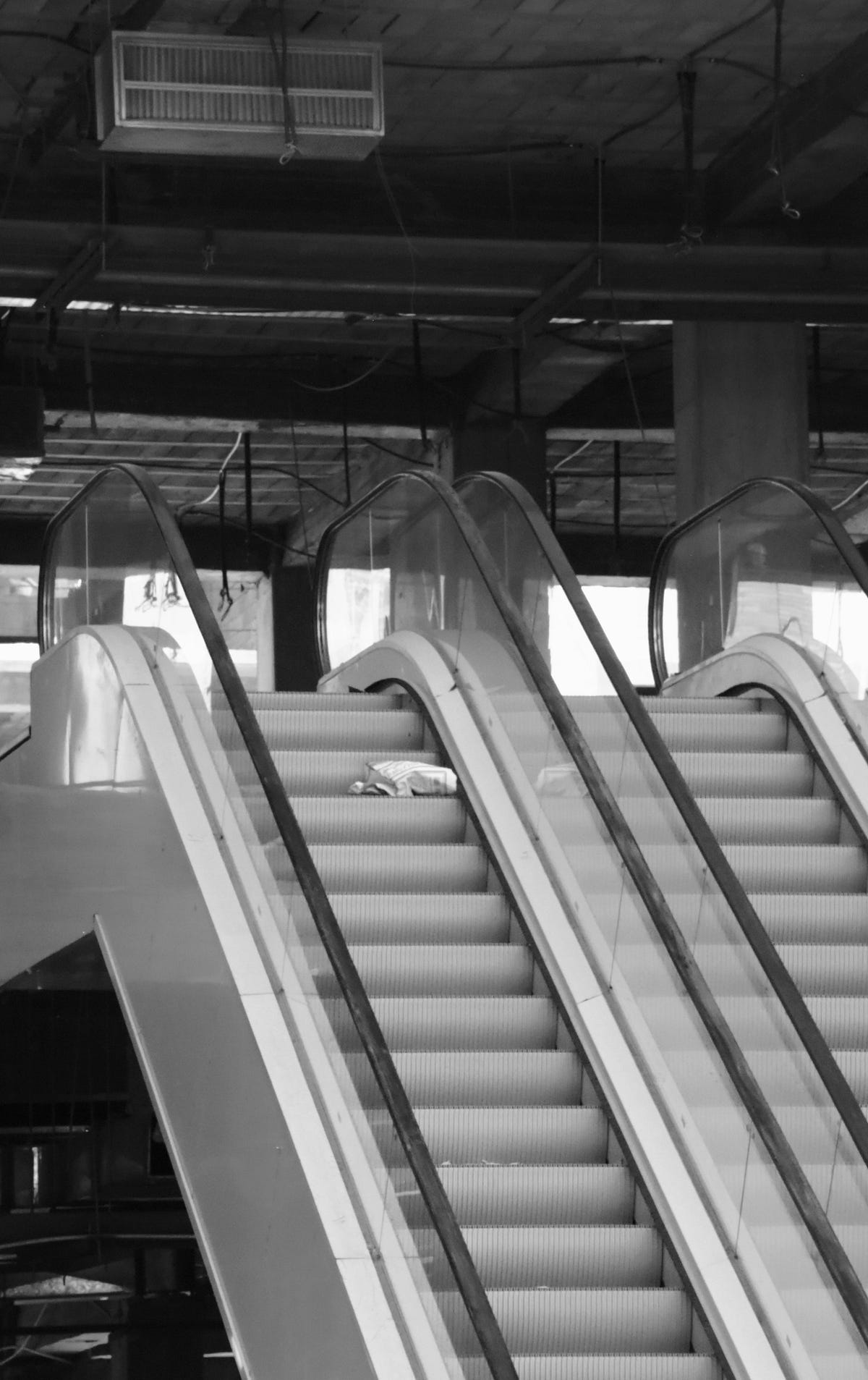 how about escalator cars with building maybe - Oluwafemio - Medium