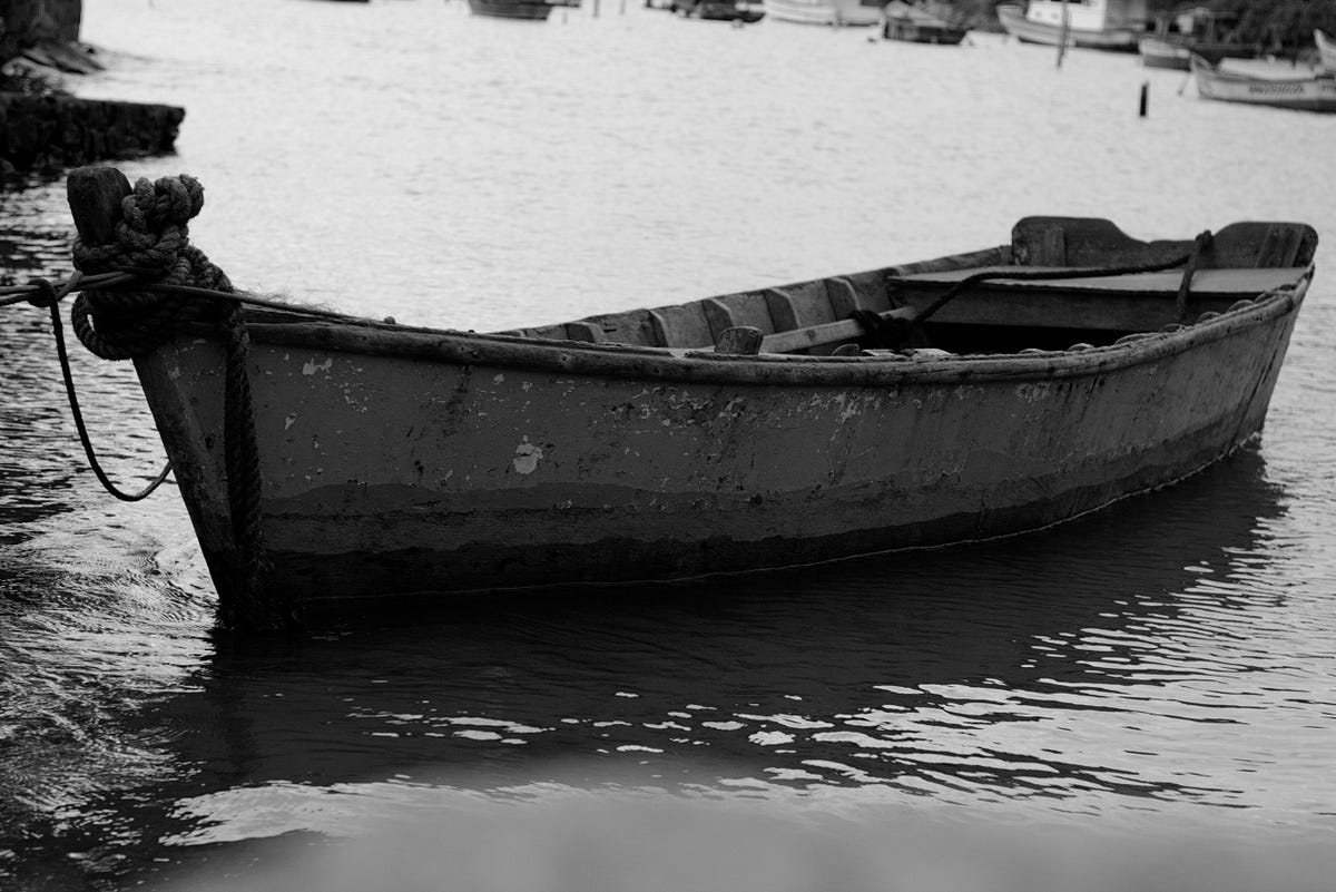 Lullaby A small boat tied to a rickety dock, Swaying with the tide ...
