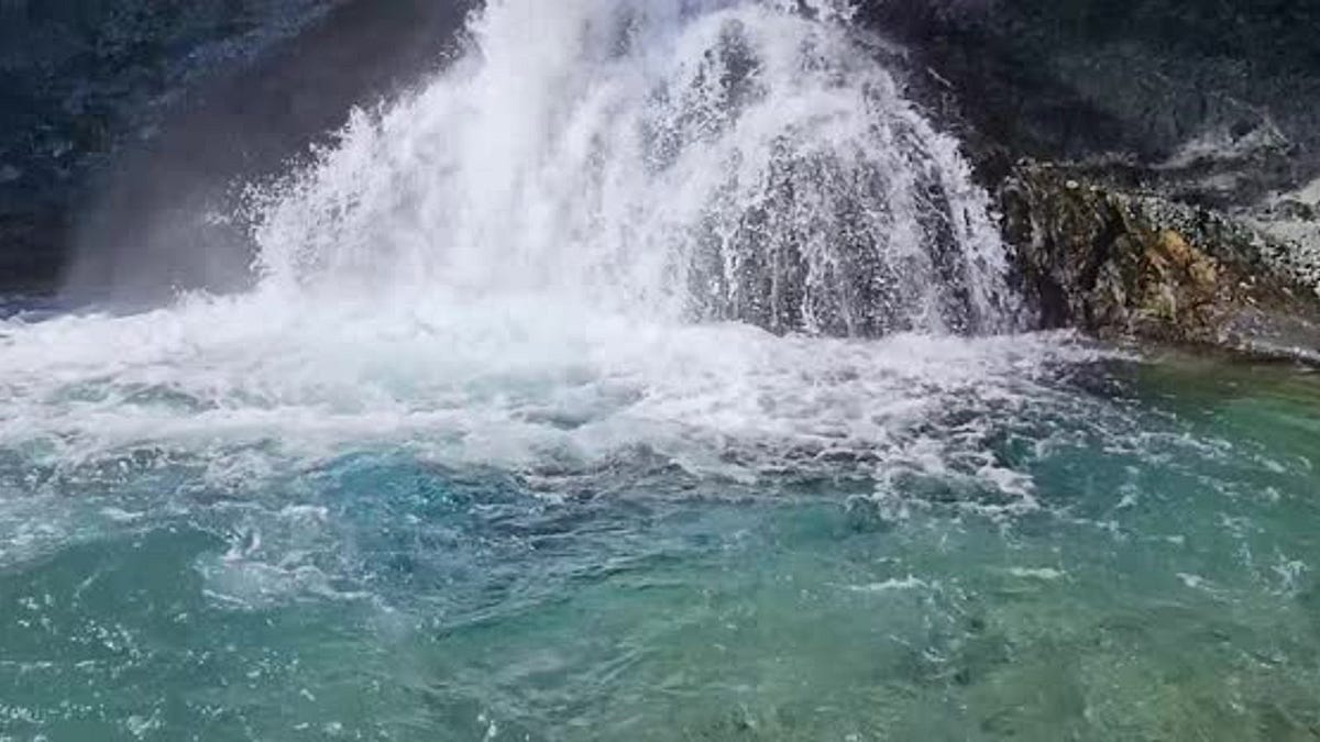 Skutafoss Waterfall’s gentle touch on the pebbles creates a soothing ...