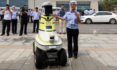 Revolutionizing Traffic Control: The Rise of Traffic Police Robots | by ...