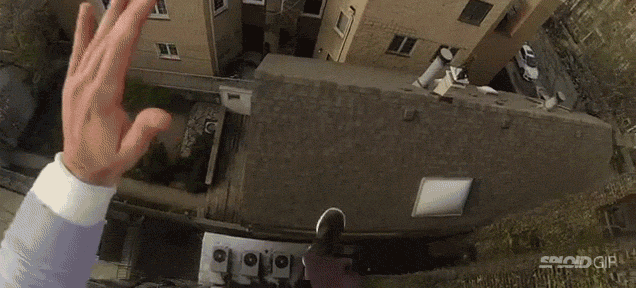 Guy jumps off a building, slides down a roof and lands on stairs for ...