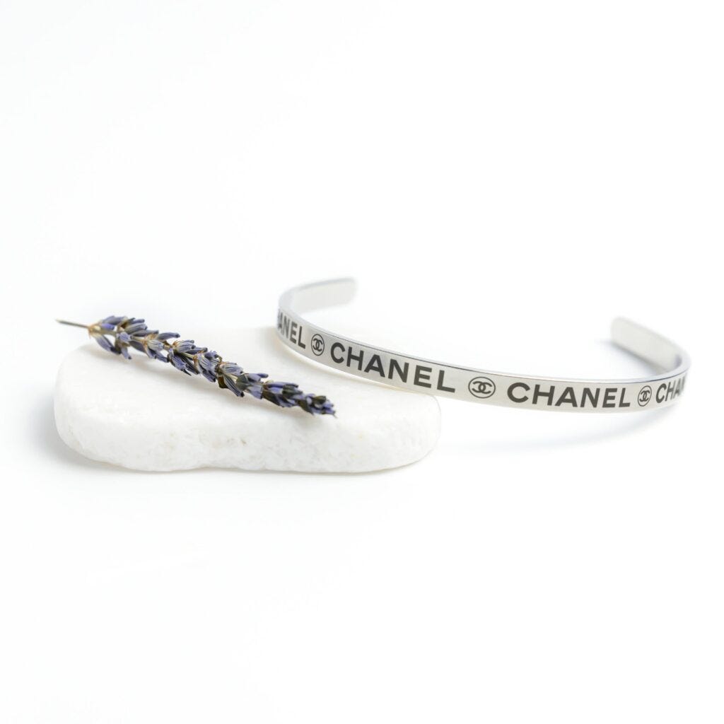 Shimmering Elegance: The Allure of the Silver Chanel Bracelet | by Emma ...