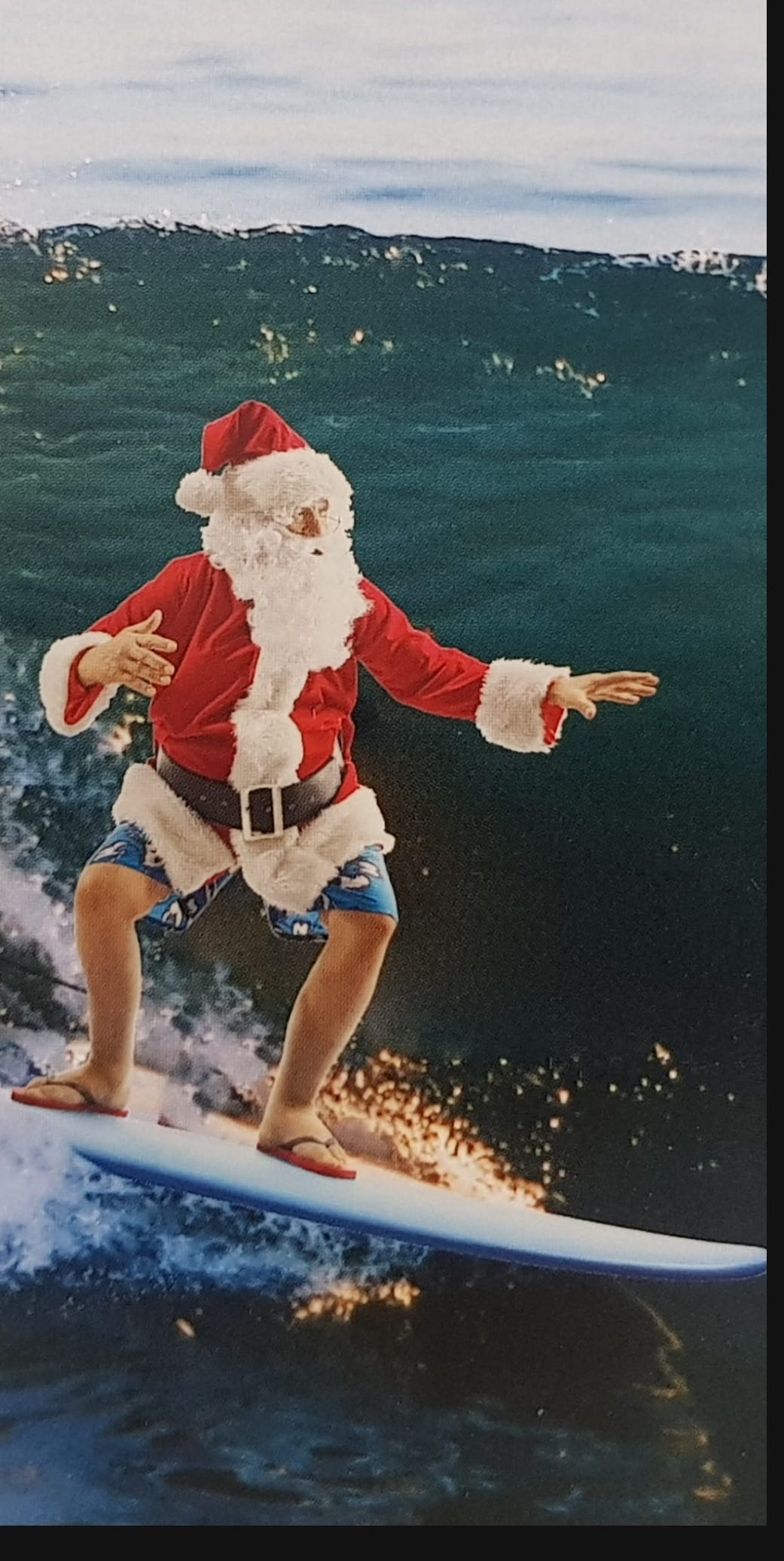 Santa surfs in to see us — on an ocean blue wave of love | by Dion ...