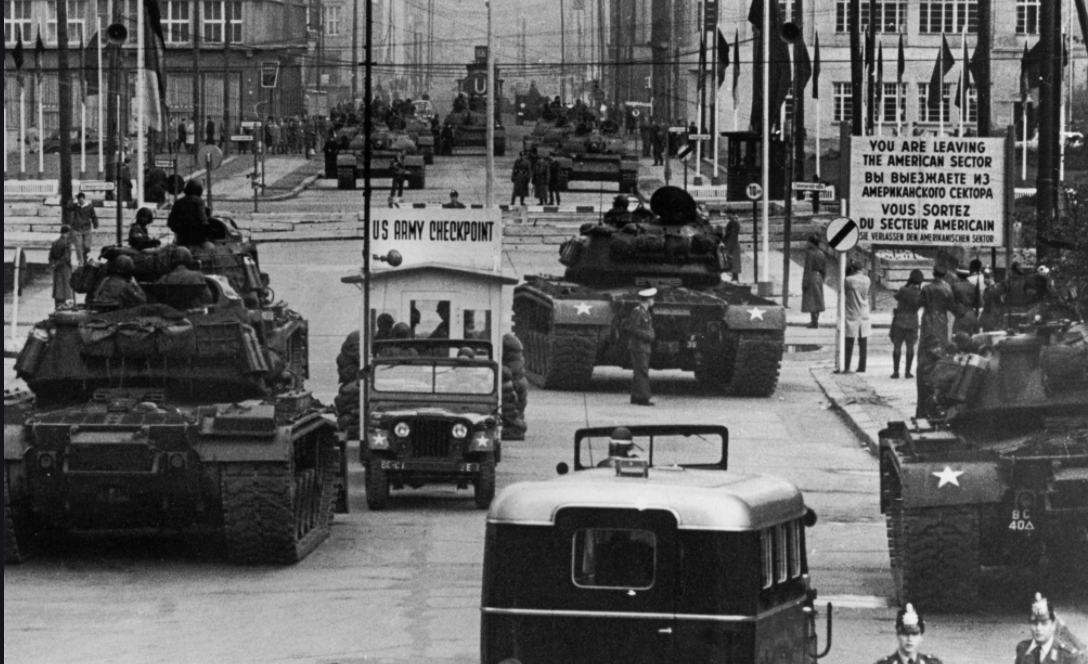 Checkpoint Charlie. The rising sun cast a rosy hue across… | by Dravida ...