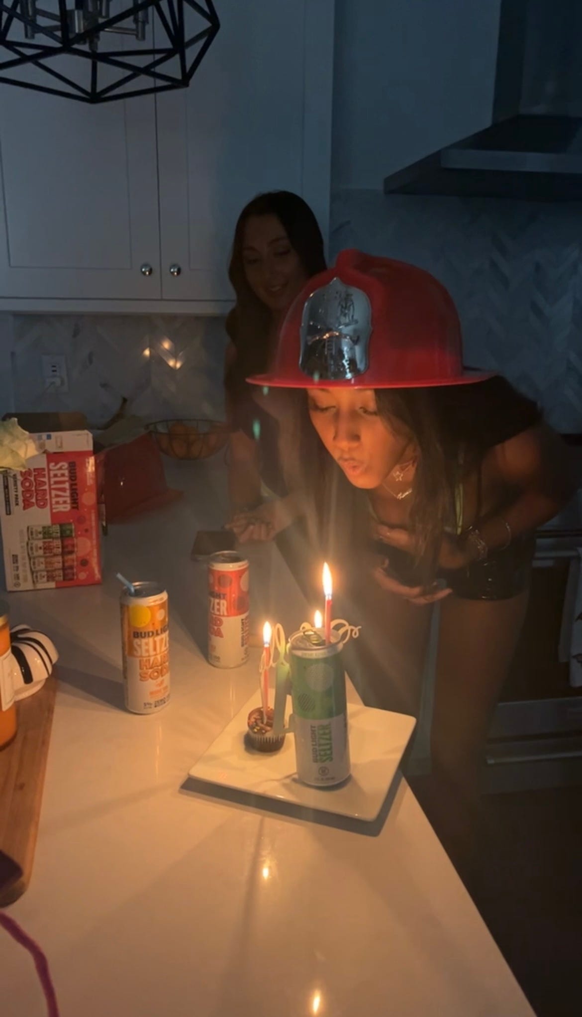 Kamila White blows out her candles on her 21st birthday while ...