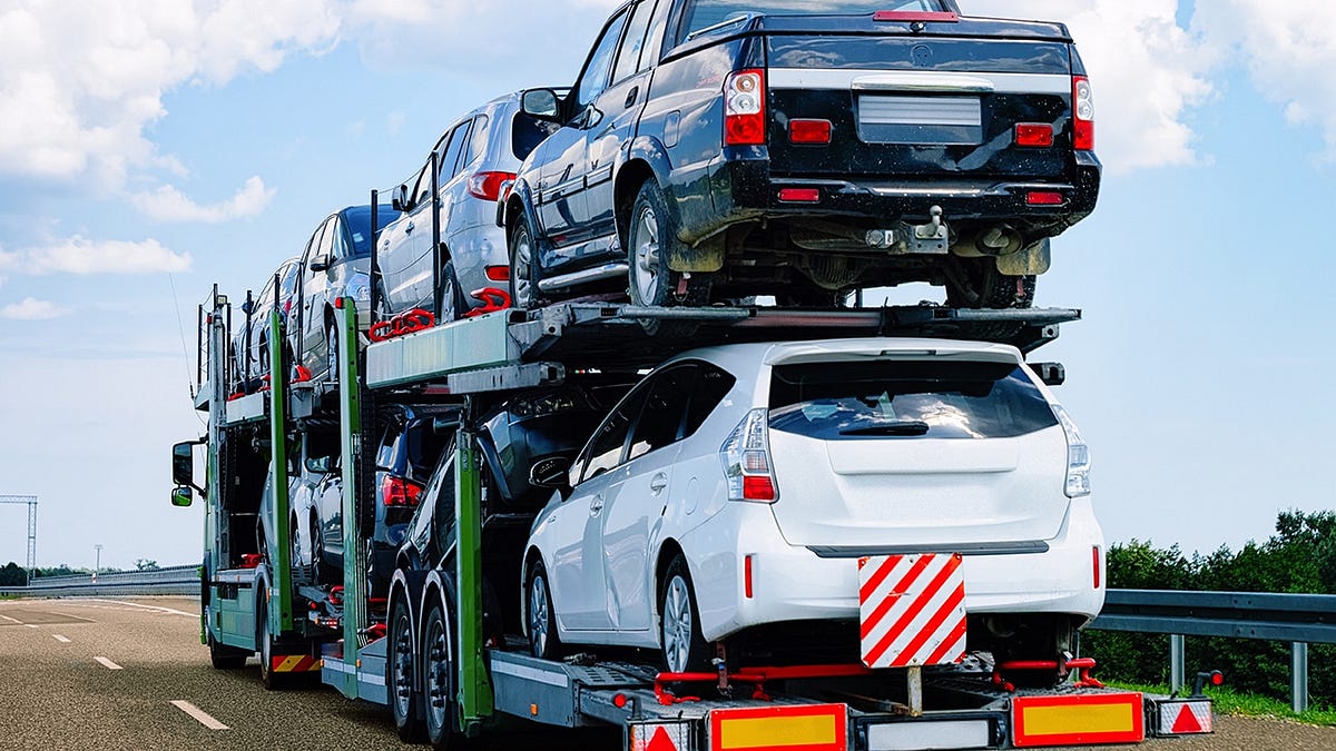 What Are the Considerations When Transporting Cars on an Open Trailer ...