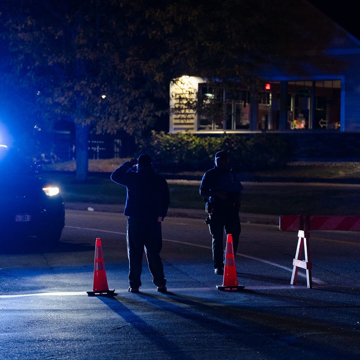 Law enforcement officers gathered last Thursday near a bowling alley in ...