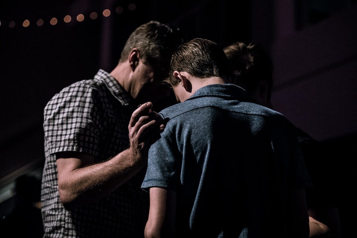 Fake Sympathy. Father and son comfort each other as a… | by BEE | Medium