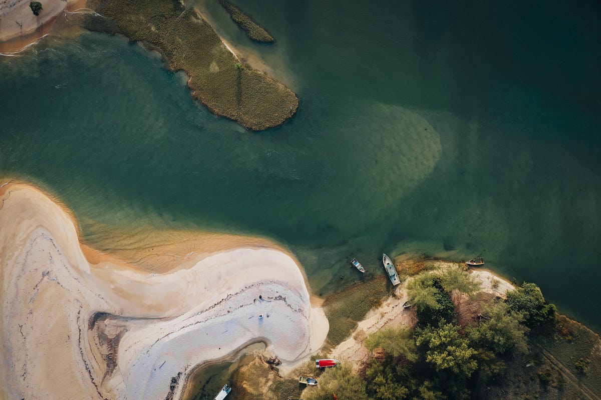 Estuary. The metal of the grated deck clanged as… | by Cybertjt | Medium