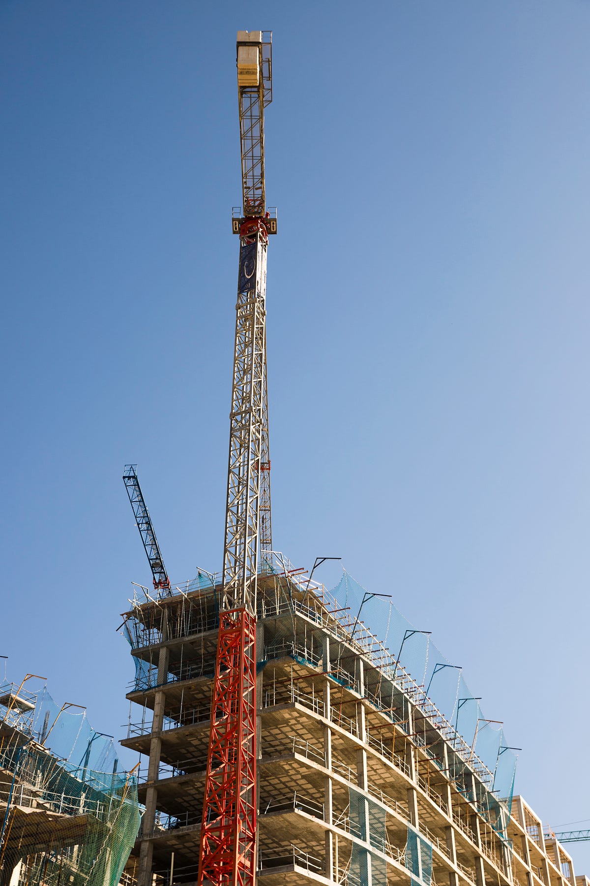 The Role of Scaffolding in High-Rise Building Construction | by Thomson ...