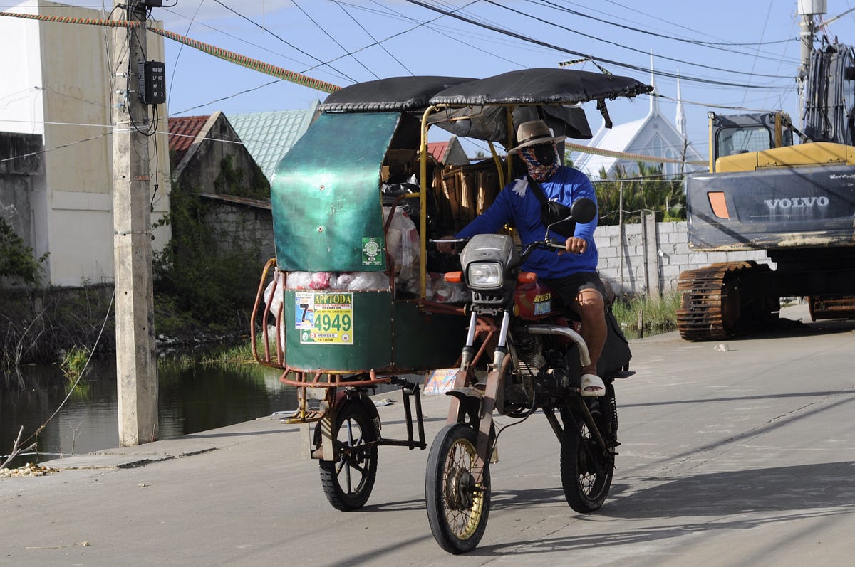 Defying the Odds: When Tricycles Go Tall in Hagonoy | by The Verity ...