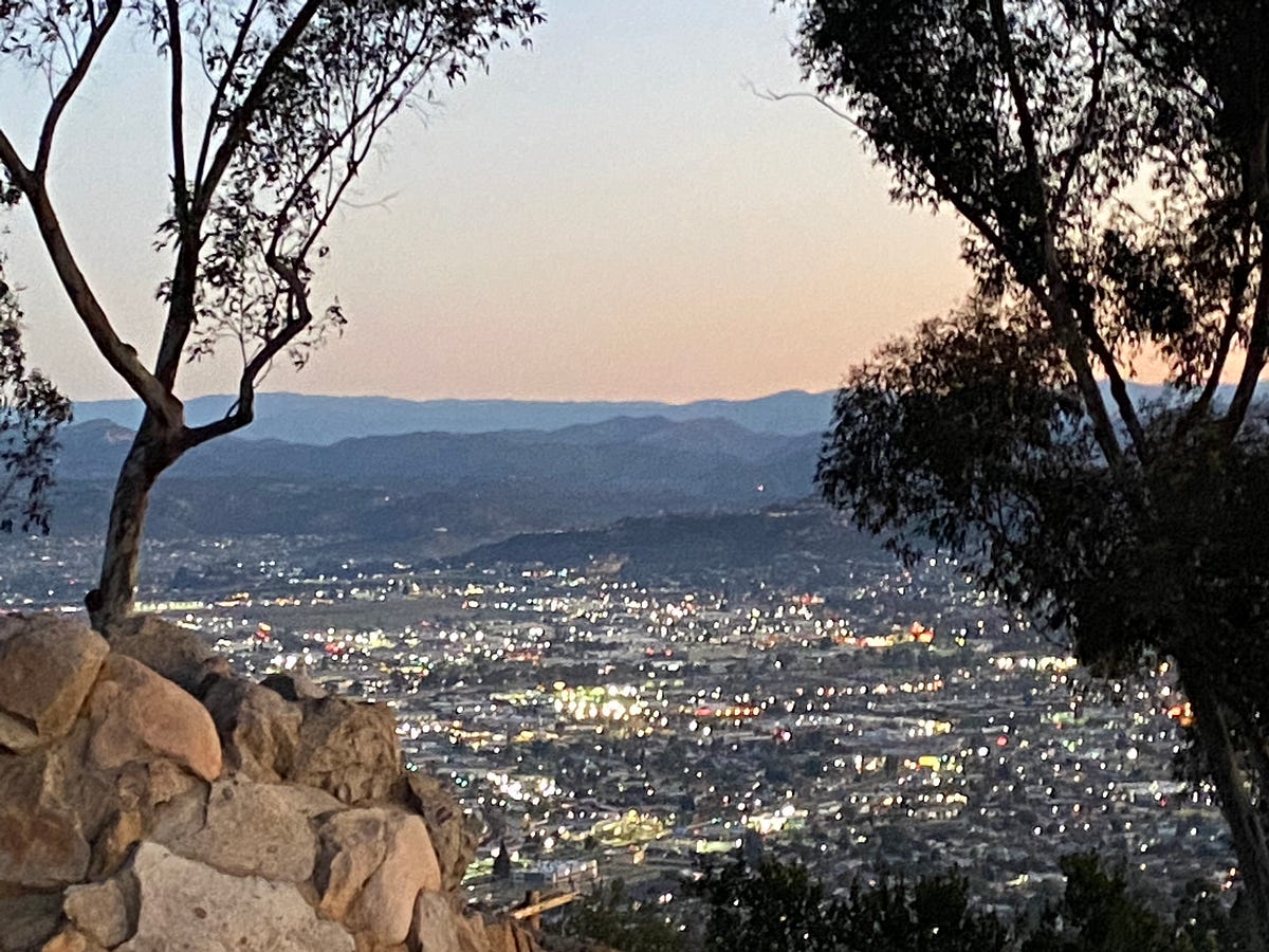 Haiku: from a mountain top. By Machette A busy city, Framed by trees ...