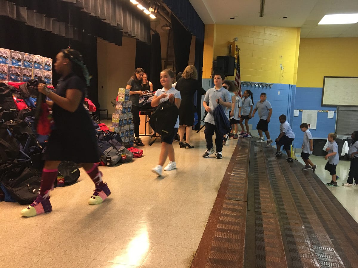 Hackett students surprised with backpacks and school supplies | by Tom ...