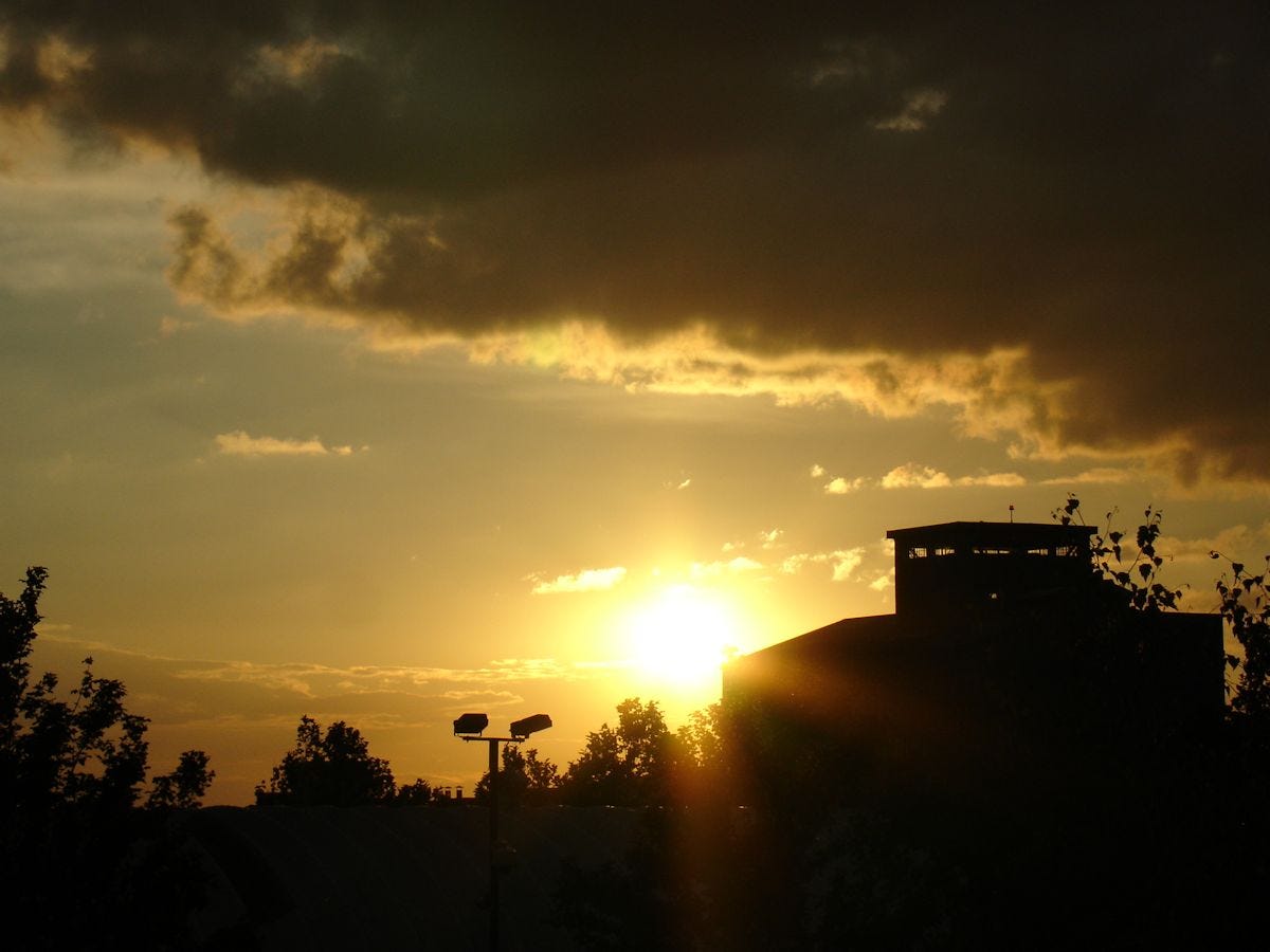 Sun setting behind wind tunnel. Setting sun after end of Farnborough ...