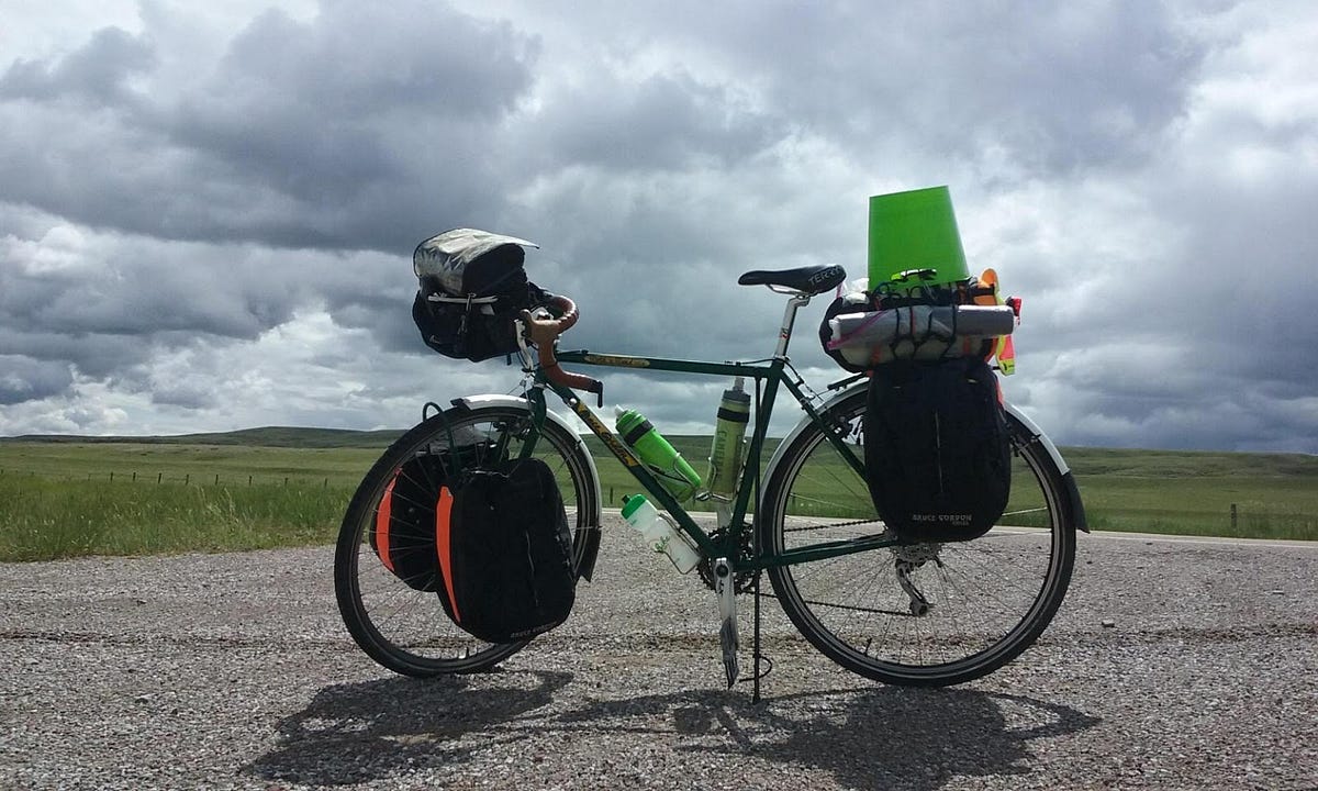 An Unwieldy Weight. A loaded touring bike represents more… | by Emily ...