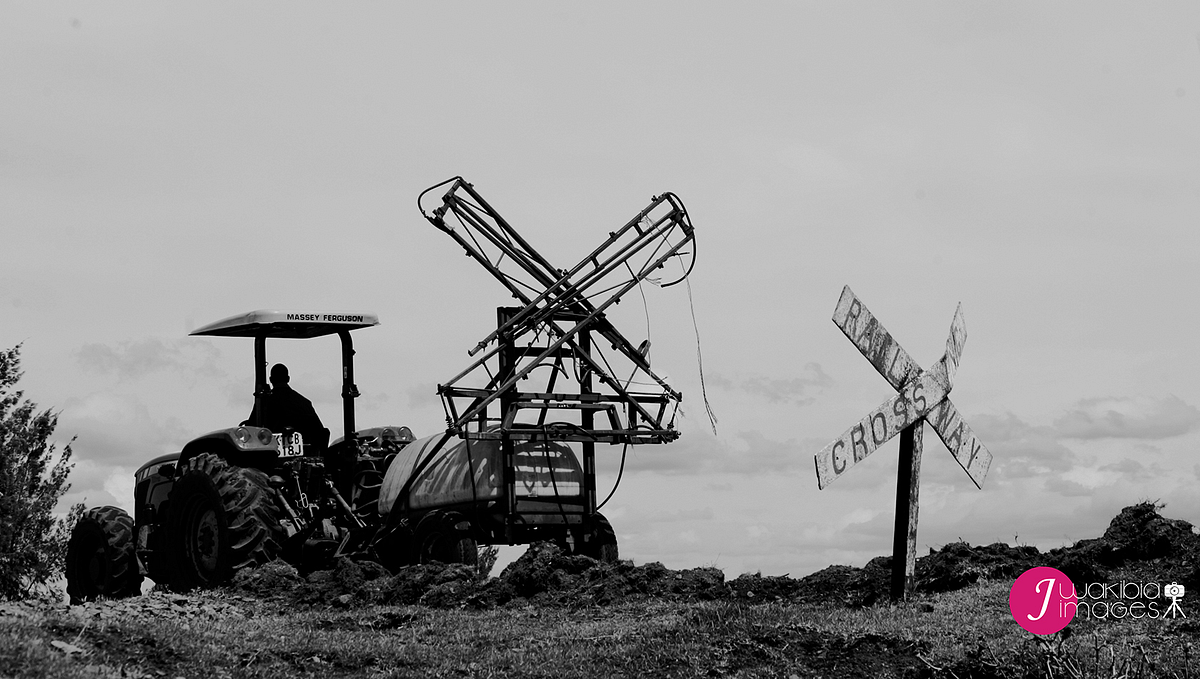 A tractor crossing a railway level crossing | by James Wakibia | Medium