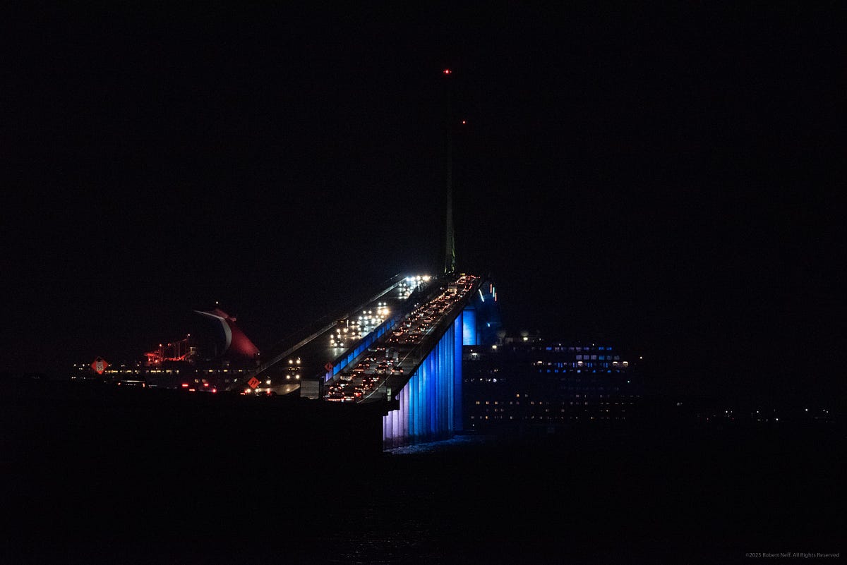 Carnival Paradise centered under Skyway Bridge | by Robert Neff | Medium