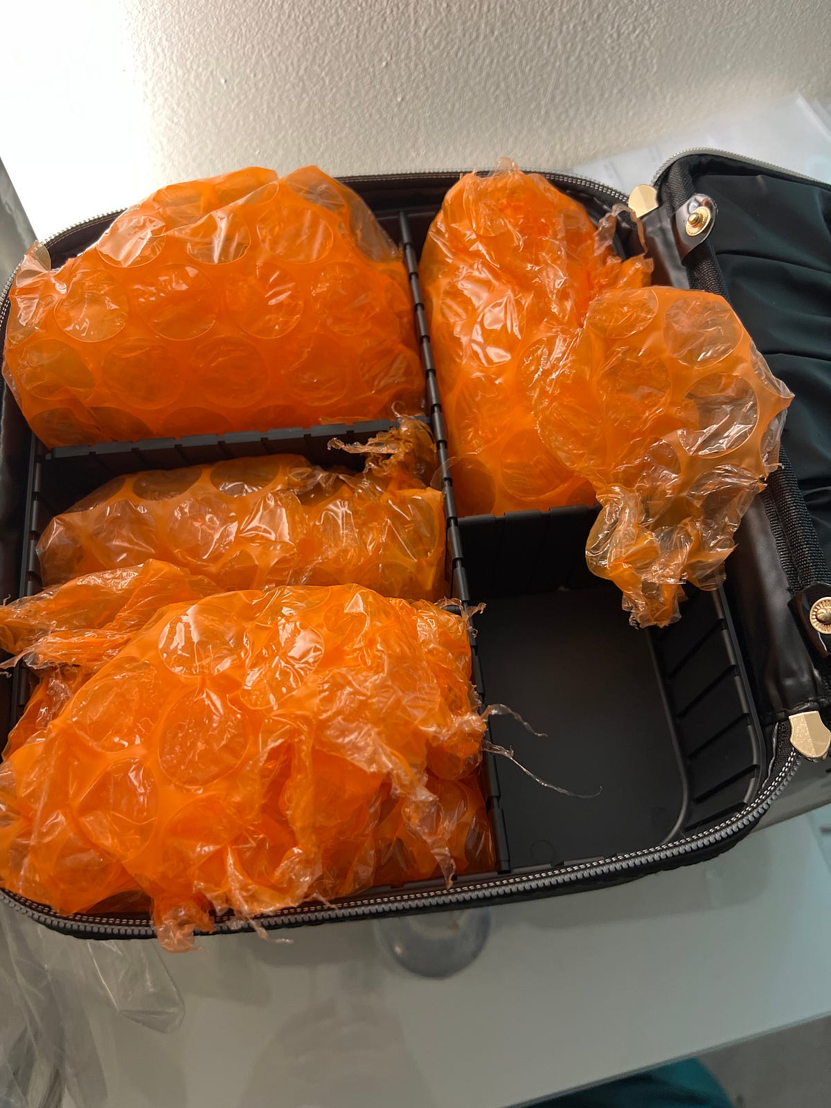 For anyone tracking, fragrance made it safe and sound. The plastic wrap + bubble wrap combo ...