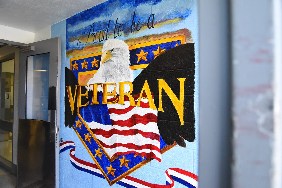 Pride in Service. A series of flags hover above the… | by MI Dept. of ...
