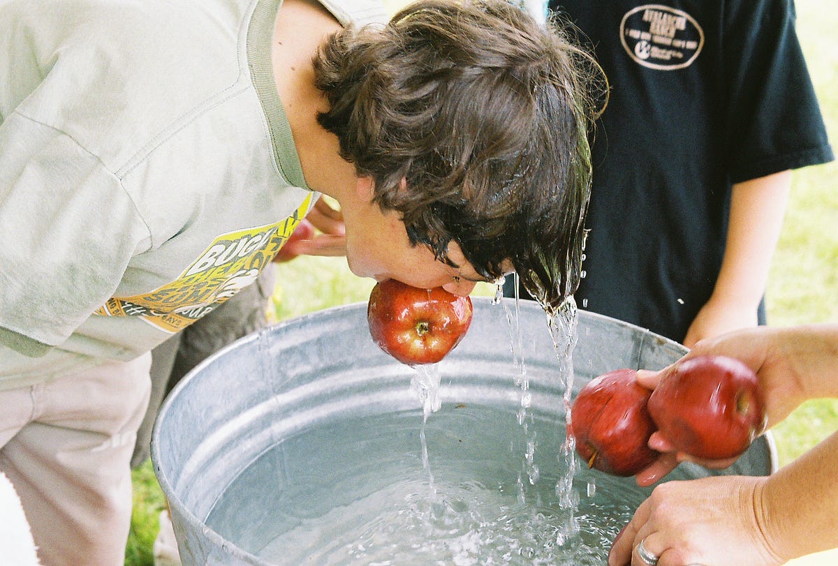 The Ancient Pagan Roots of Bobbing For Apples | by Grant Piper | Medium