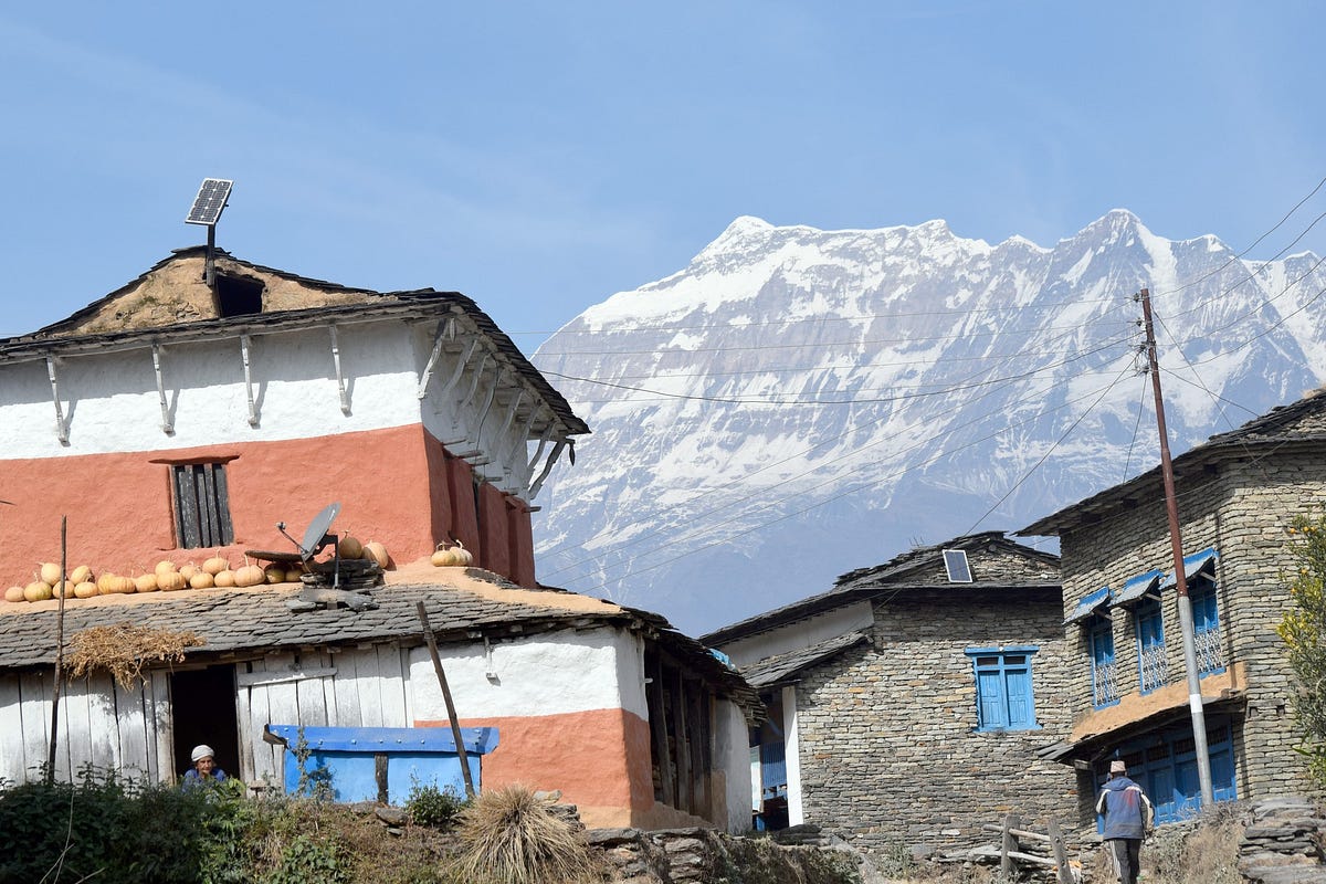 Gurja and Churen Himal seen in the background of a traditional house in ...