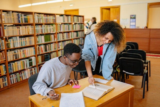 Student Studying In Library