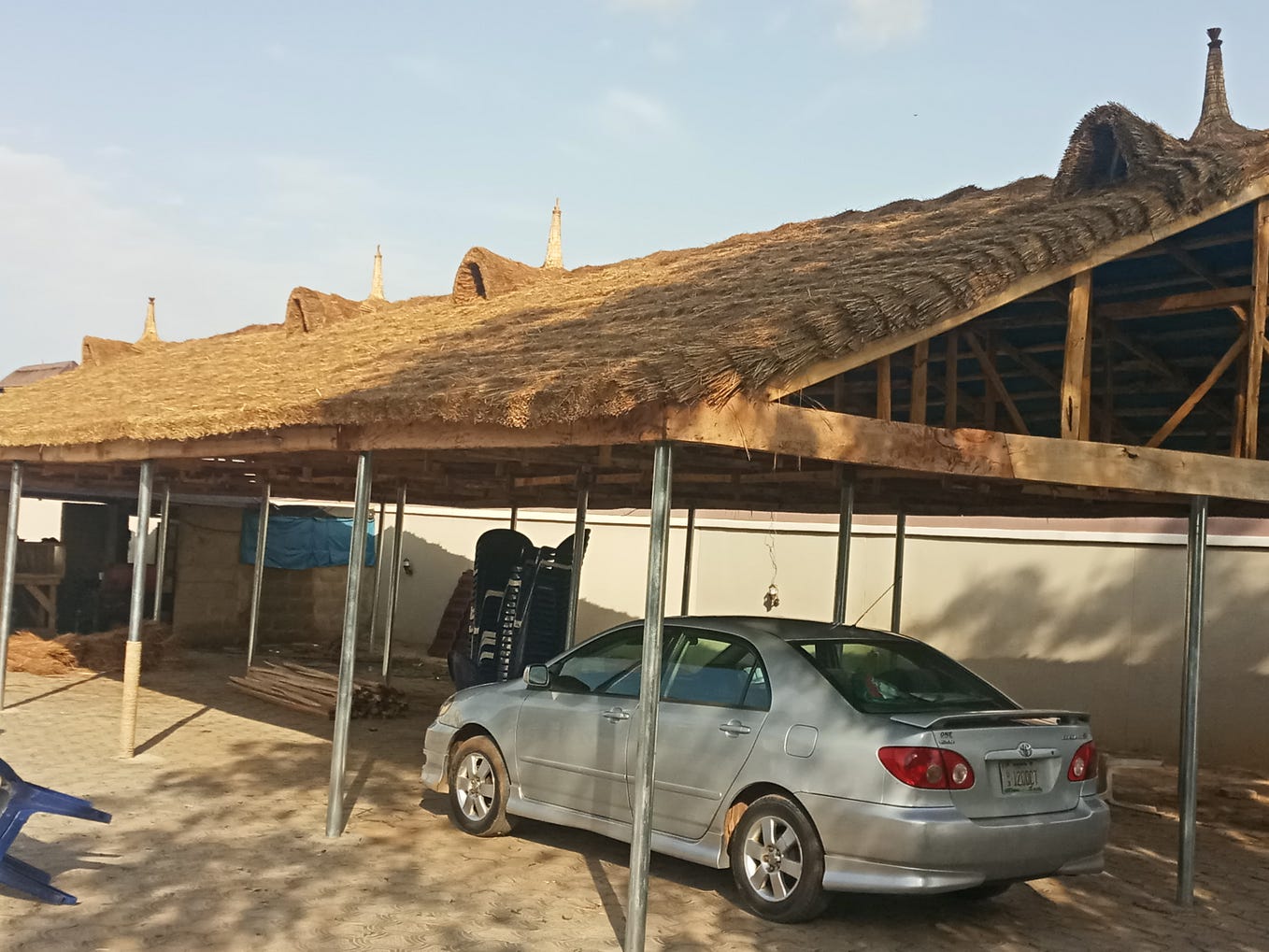 The making of a modern thatched house somewhere in Zaria, Kaduna State ...