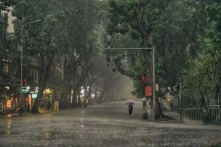 Menyulam Hujan dengan Cahaya Langit menangis dalam sunyi Di balik tirai awan yang muram Tiap ...