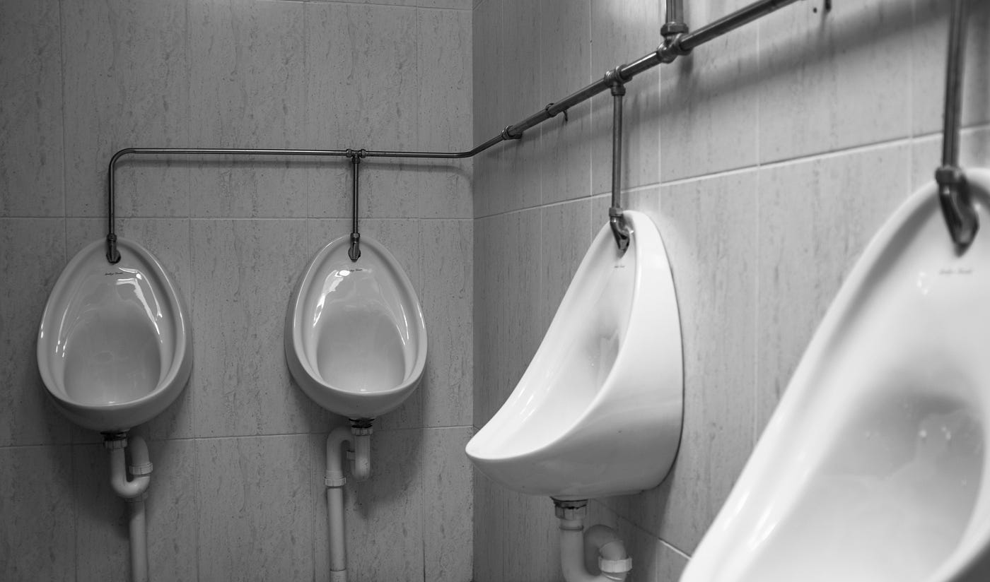 Men Using Urinals The Bathroom