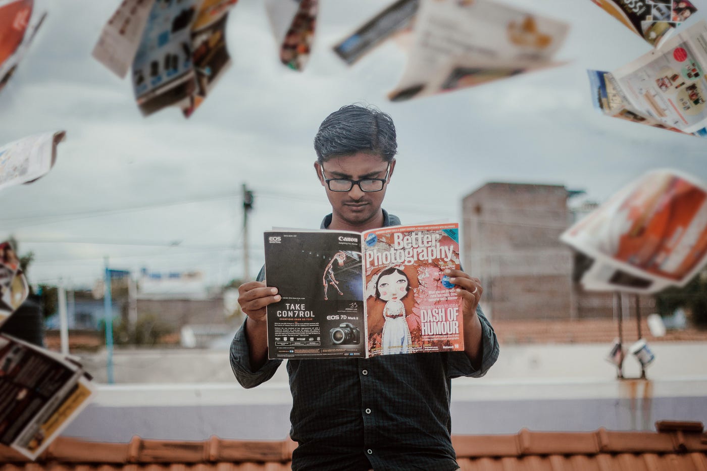 People Reading A Magazine