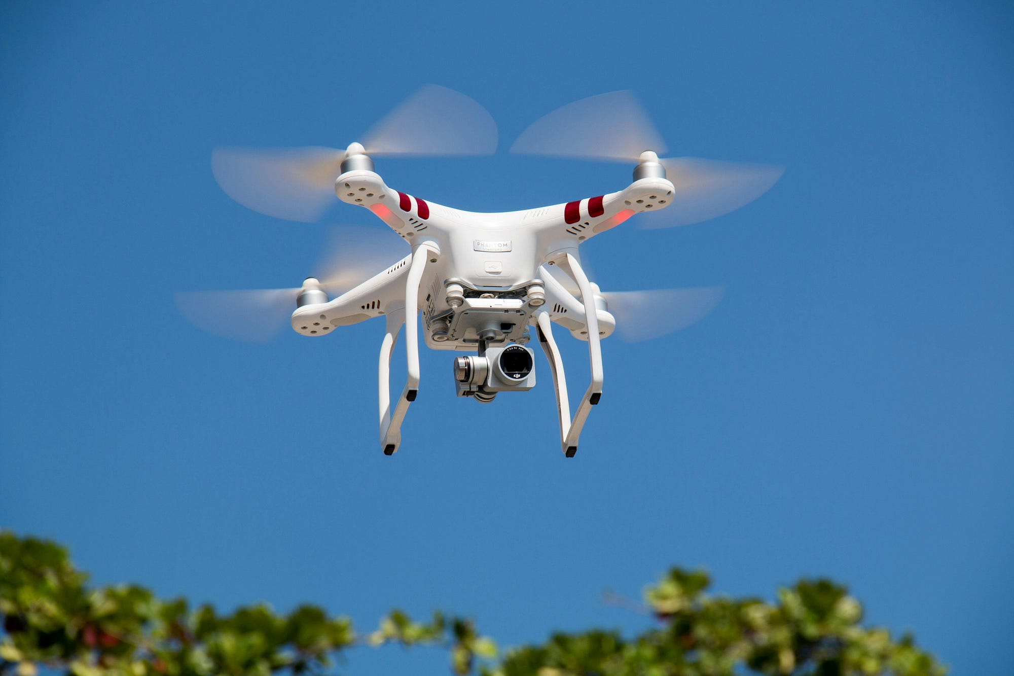 White drone with red stripes store