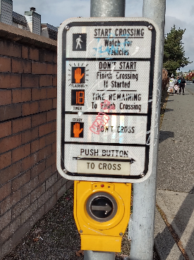Crosswalk Buttons With An Attitude | by John Robinson | Medium