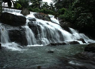 Aruvikuzhy Waterfalls. The Aruvikuzhi Waterfalls are… | by Abel ...