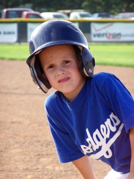 Little Boy Playing Baseball