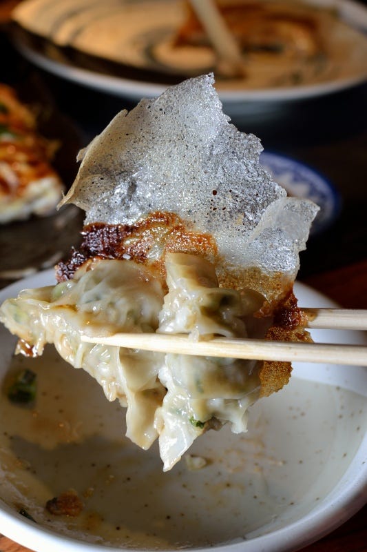 “Hanetsuki-gyoza” is a pan-fried gyoza (dumpling) with an extra crispy ...
