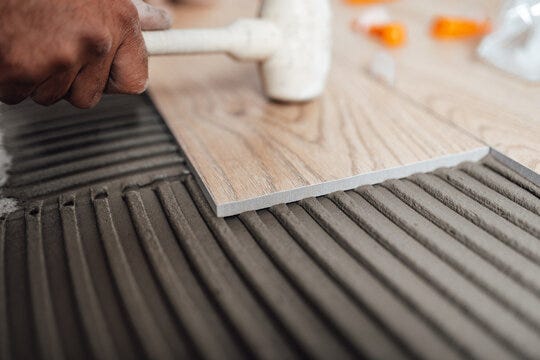 Why tile adhesive is best for laying tiles? | by Arunimars | Medium
