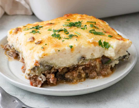 Greek Moussaka. Greek moussaka is a beloved dish that… | by ChefCHarm olivia | Medium
