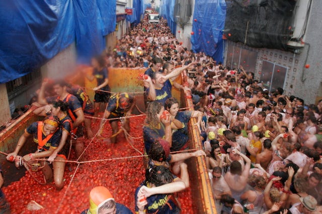 La Tomatina — the world’s biggest food fight | by Janet Christian | Medium