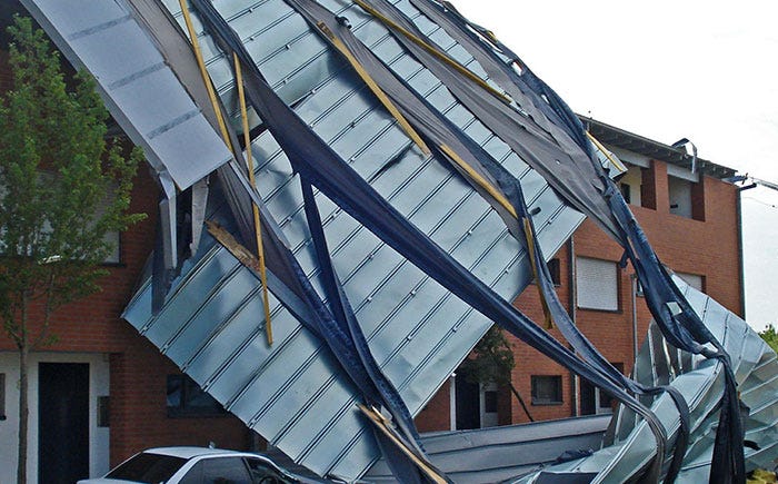 Commercial Roof Damage - Authentic Roofing LLC - Medium
